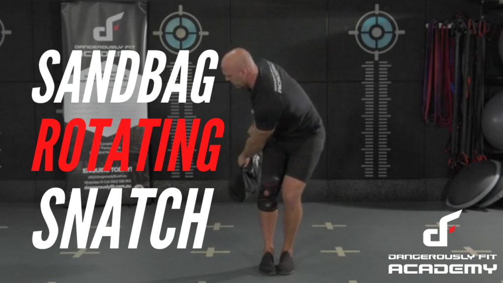 Rotating Sandbag Snatch - Dangerously Fit Academy